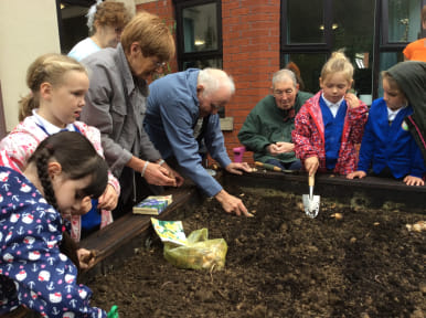 Inter-generational gardening at care home