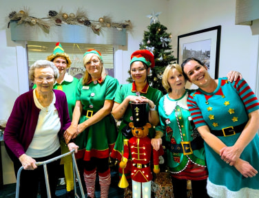 Colleagues & Residents Embrace Elf Day Fun and Mischief!