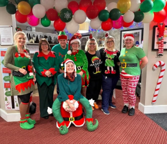 Colleagues & Residents Embrace Elf Day Fun