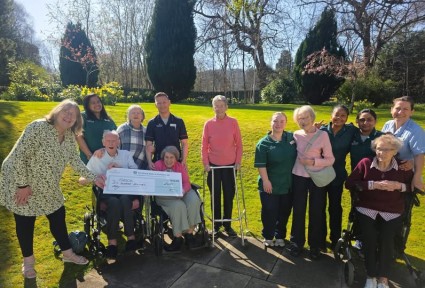 LOCAL CARE HOME PRESENTS CHEQUE TO LOCAL CHARITY